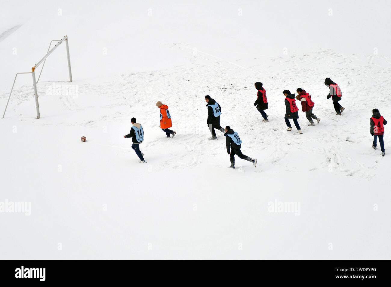 YANTAI, CHINA - JANUARY 22, 2024 - Students play a snow soccer game in ...