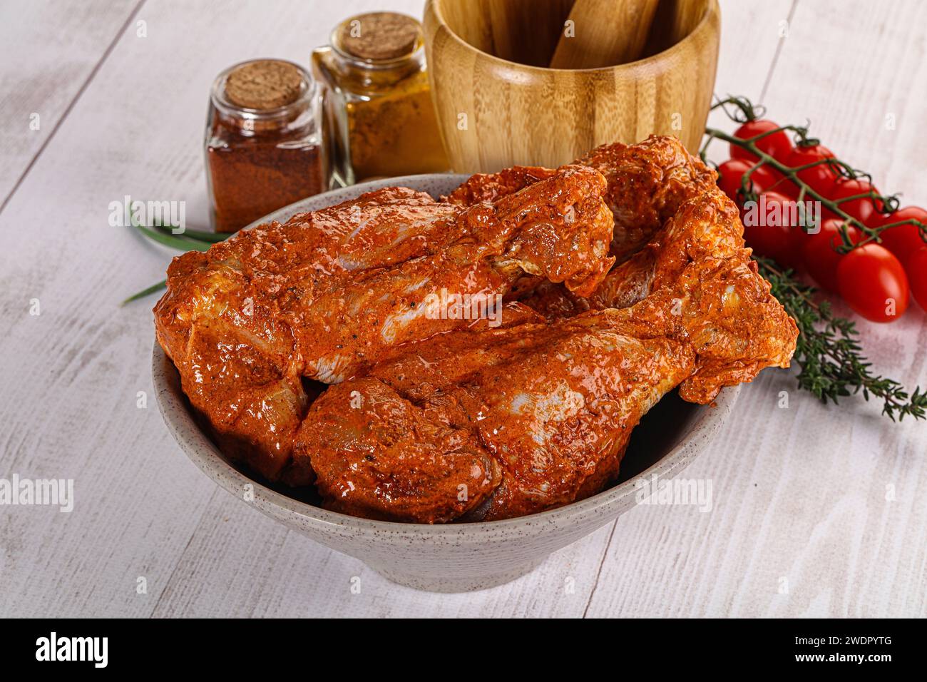 Raw turkey shoulder wing in Indian tandoori marinade spices Stock Photo ...