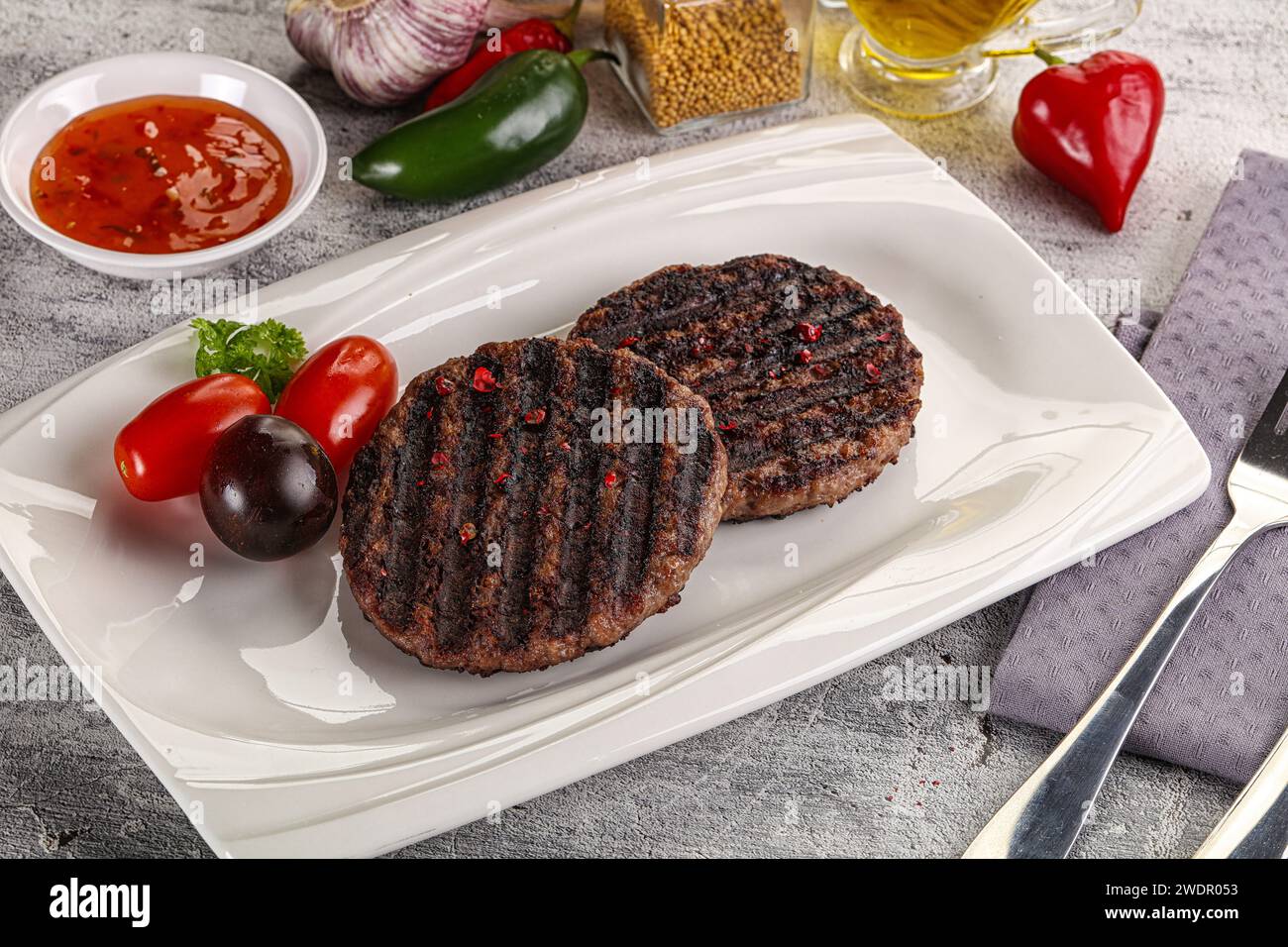 Grilled beef burger cutlet with sauce Stock Photo - Alamy