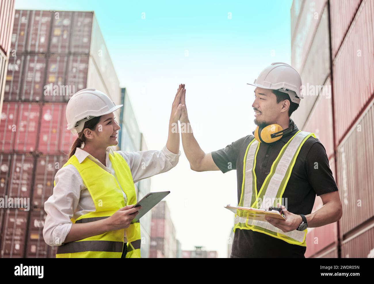 Engineer man and woman with high five , Celebration Success Happiness ...