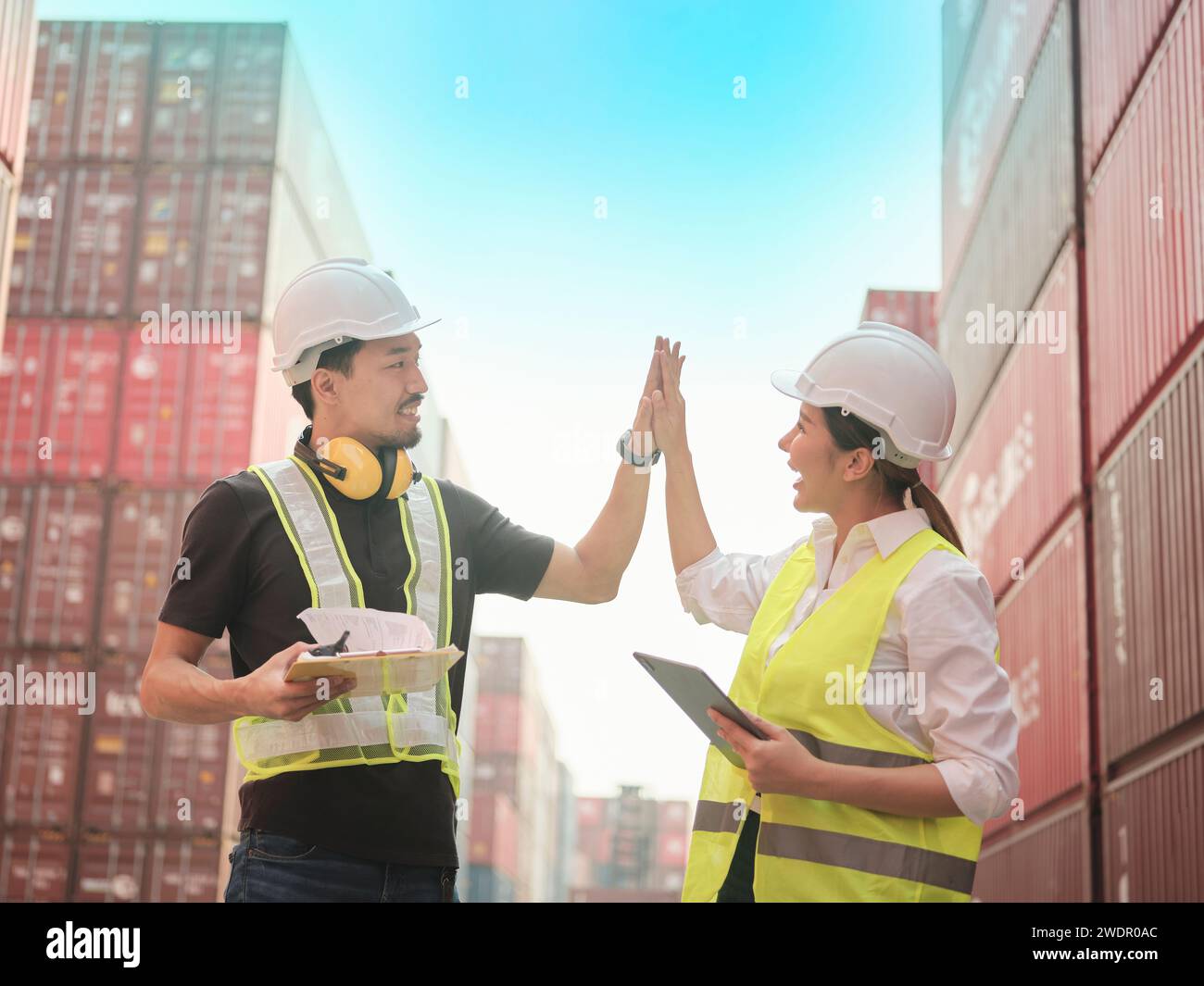 Engineer man and woman with high five , Celebration Success Happiness ...