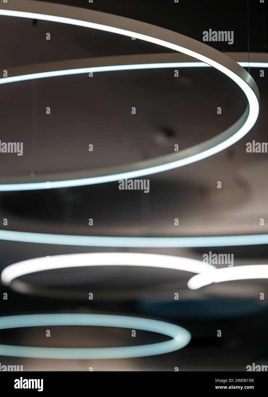 The circular pendant lights hanging from the ceiling Stock Photo - Alamy