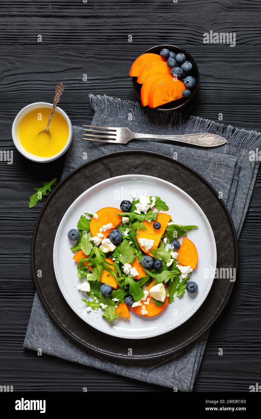 arugula persimmon white greek cheese and blueberry salad with honey and ...