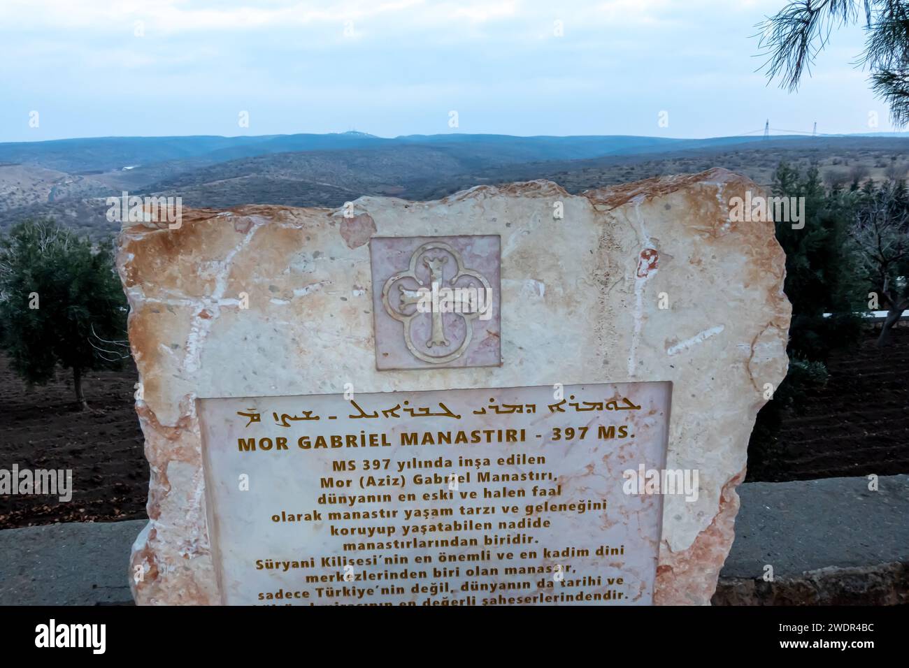 Mor Gabriel Monastery information stone, Turkey with a view of Midyat ...