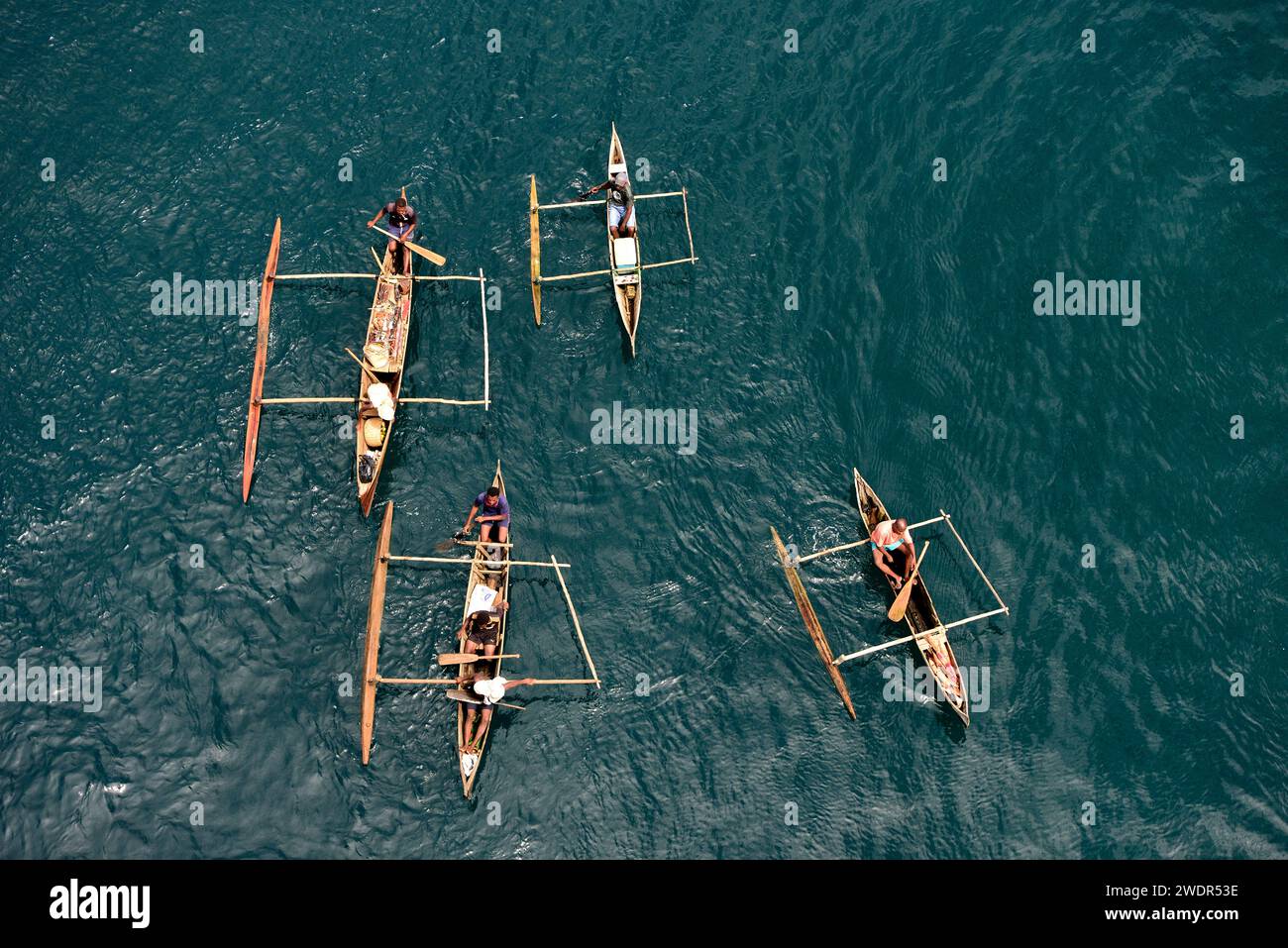 Vendors of local products, outrigger boats, harbour, Noisy Be ...