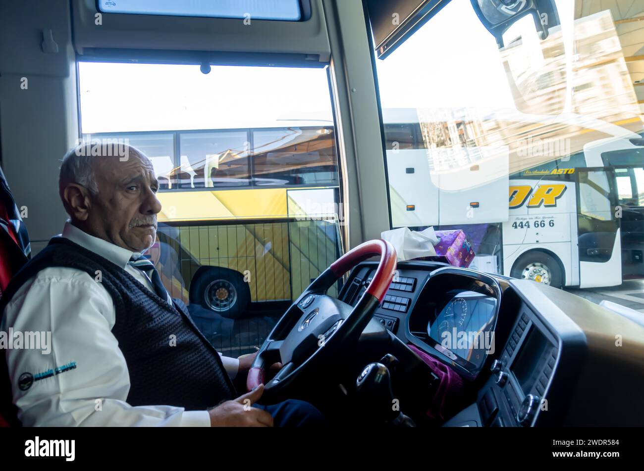 Turkish bus driver behind the wheel at Mercedes-Benz manufactured bus ...