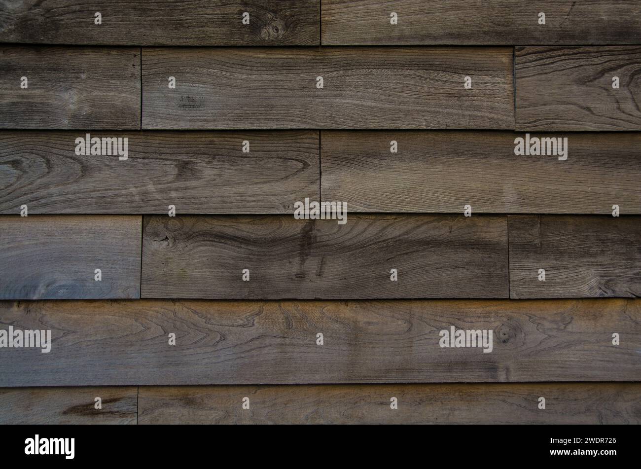 A close up of a wooden wall, showing the horizontal wood planks making ...