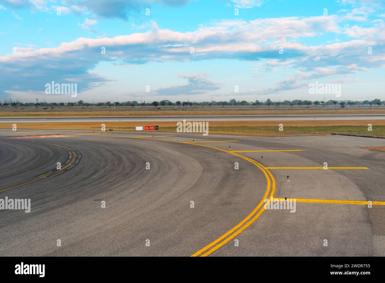 Turning onto the runway from the taxiway leaving for the takeoff at the ...