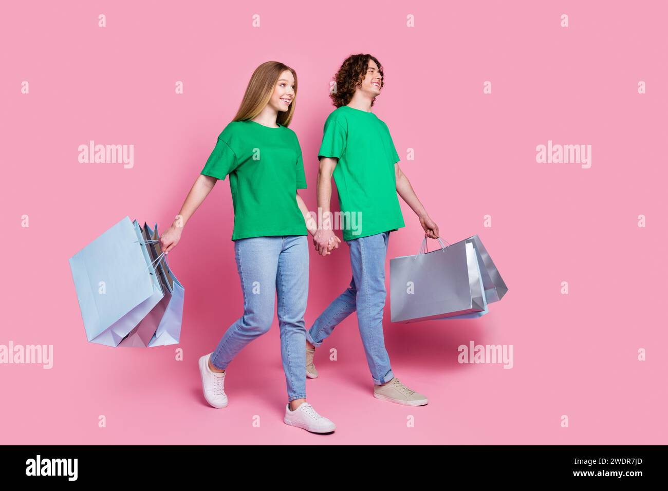 Full body photo of teenage family brother and sister holding hands and ...