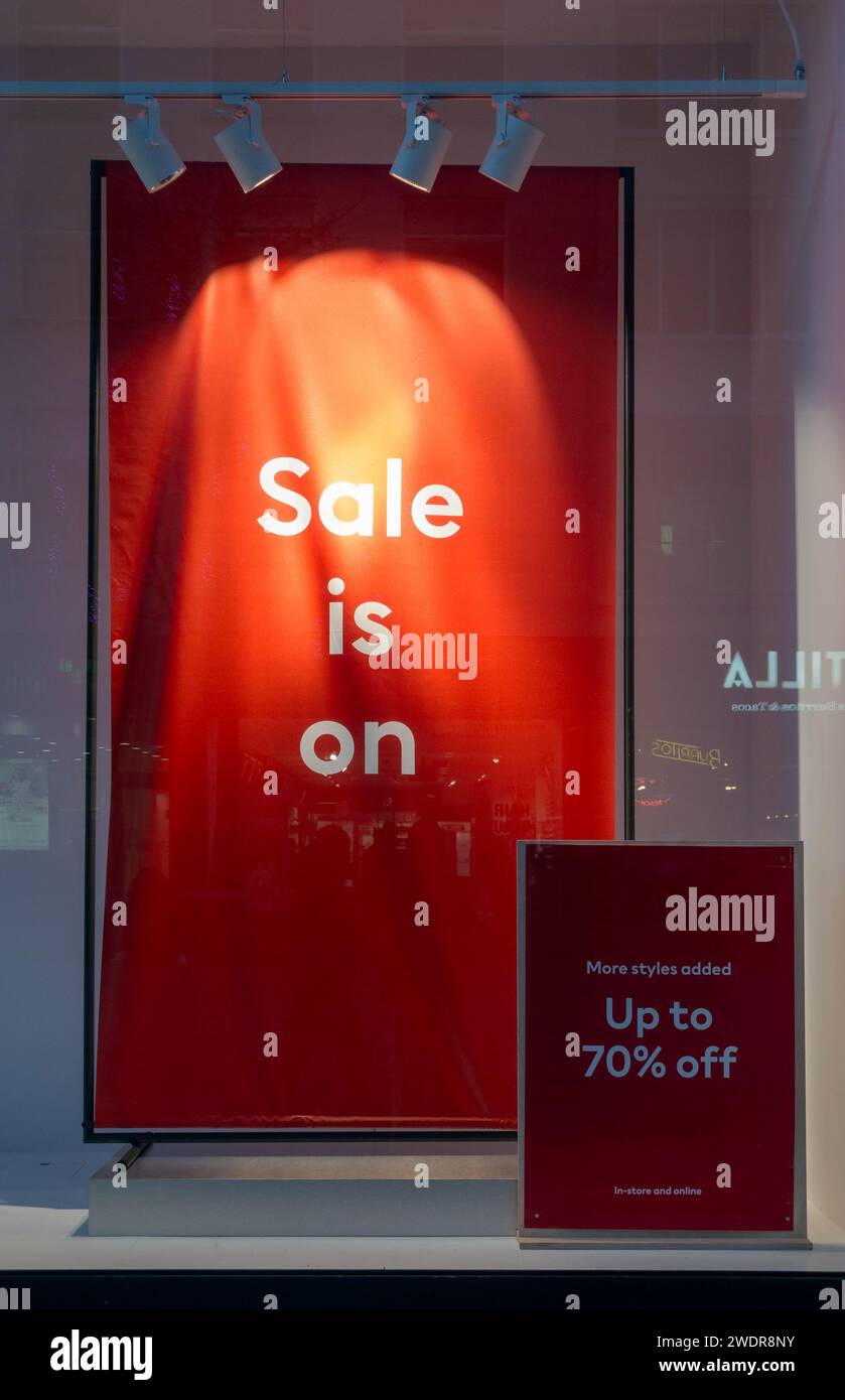 Sale is On red sign in shop window in Liverpool Stock Photo - Alamy