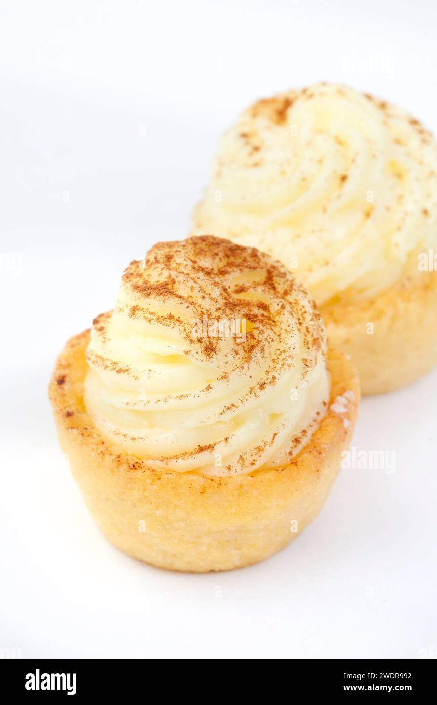 Mini South African milk tart cups isolated on white with copy space and ...