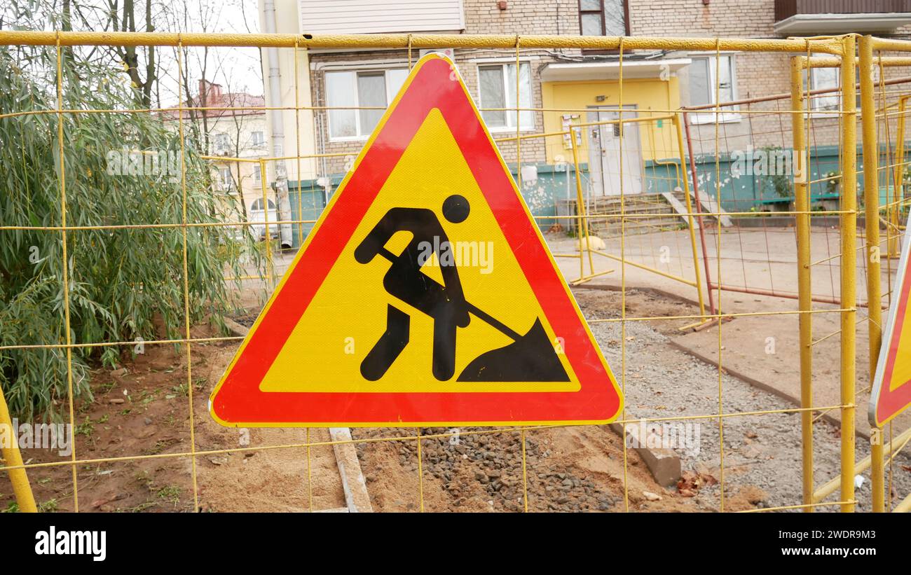 Road works signs on a fence, construction and building industry Stock ...