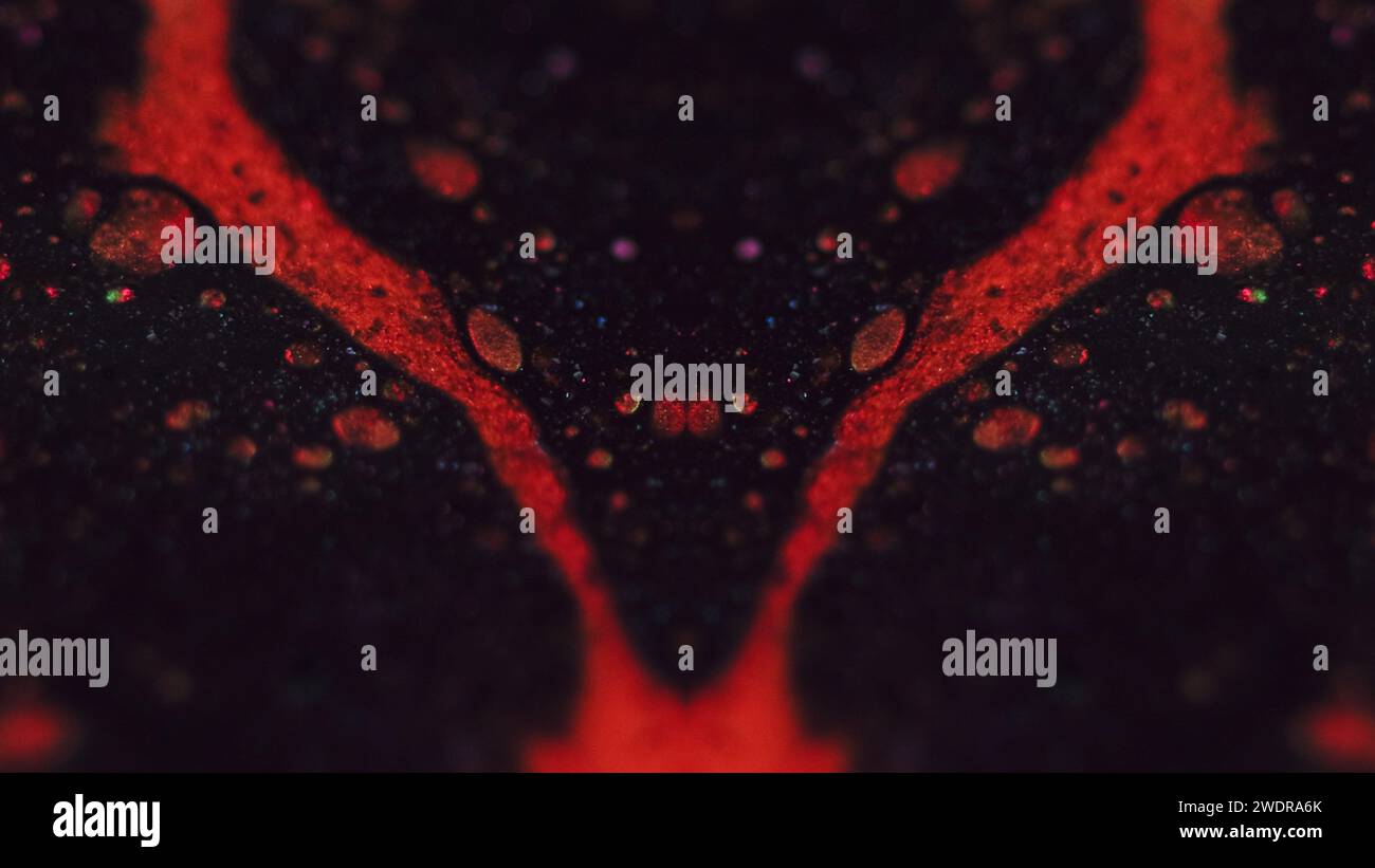 Paint spill ink kaleidoscope red black fluid drip Stock Photo - Alamy