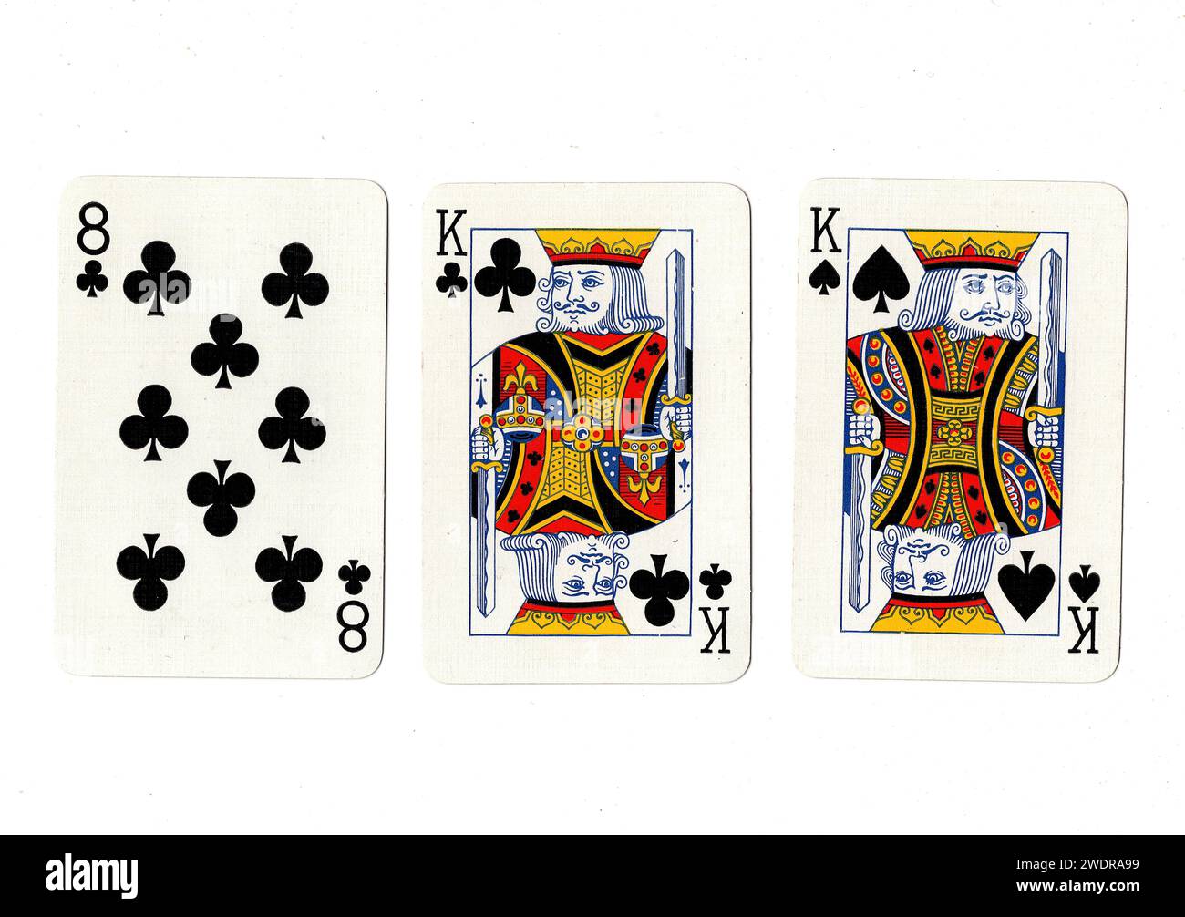 Vintage playing cards showing a pair of black kings and a black eight ...
