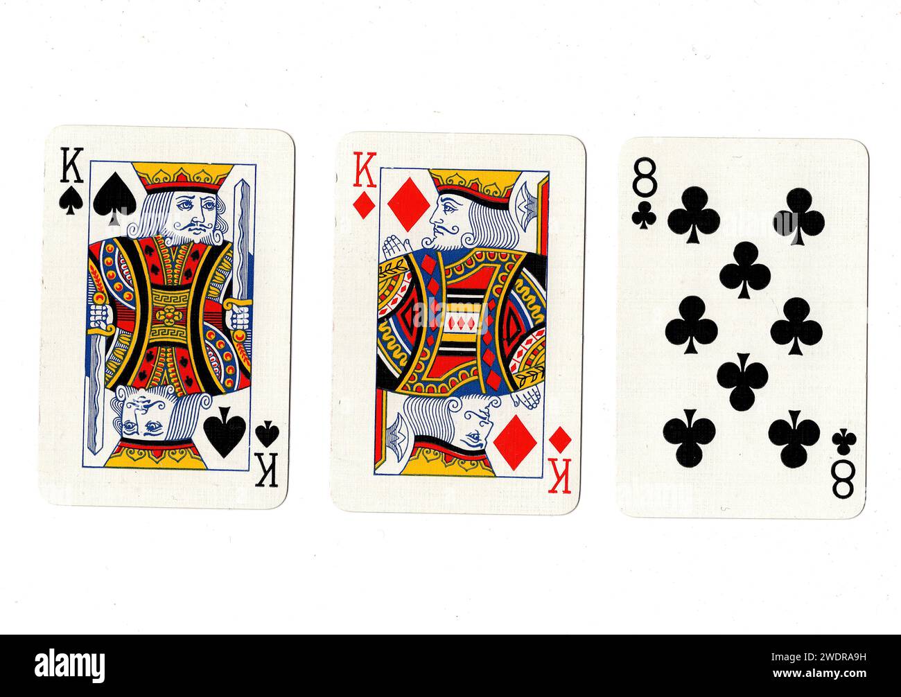 Vintage playing cards showing a pair of kings and a black eight ...