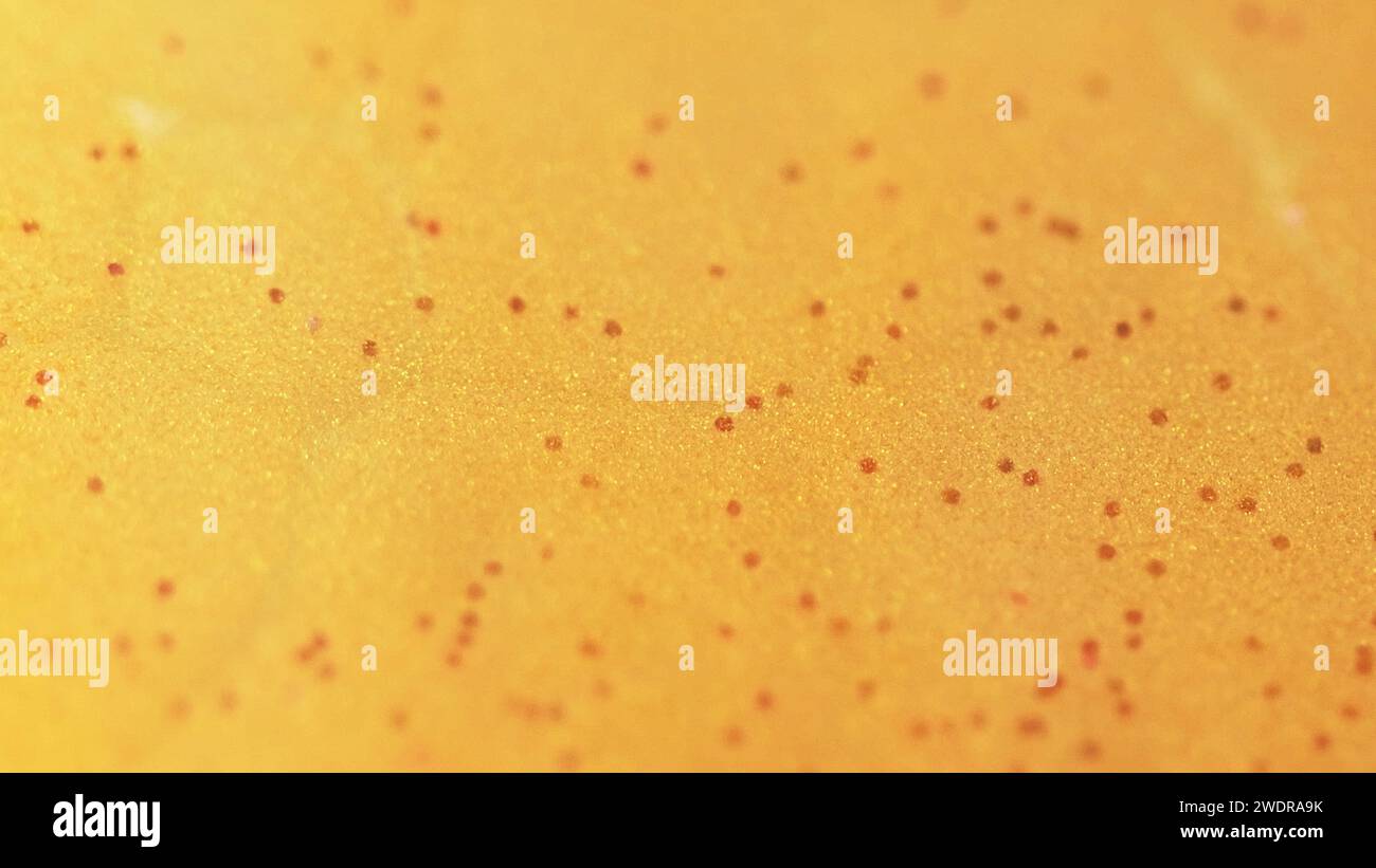 Glitter fluid splatter shiny gel drip yellow red Stock Photo - Alamy