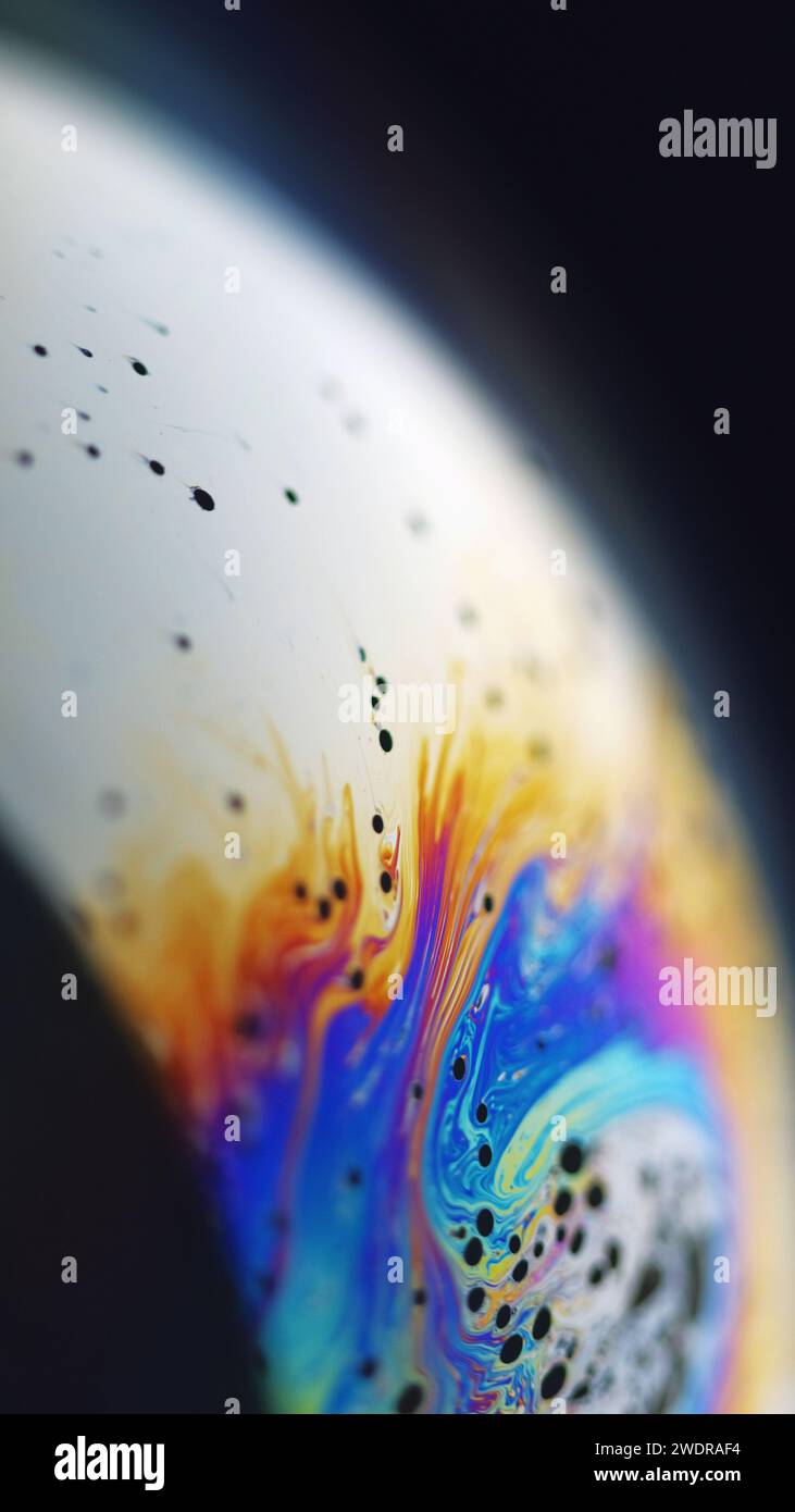 Paint mix holographic sphere rainbow oil stain Stock Photo - Alamy