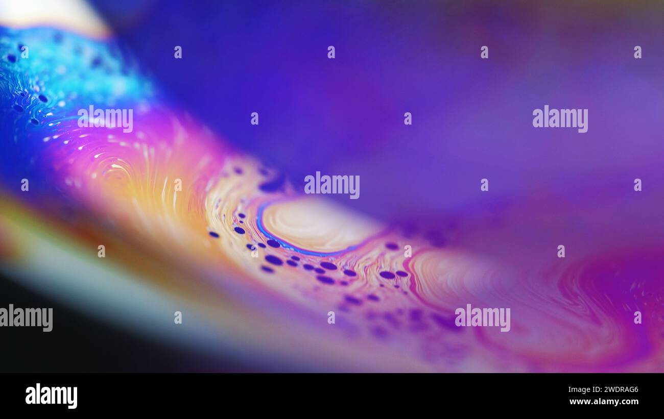 Dye mix neon fluid rainbow purple oil paint blend Stock Photo - Alamy