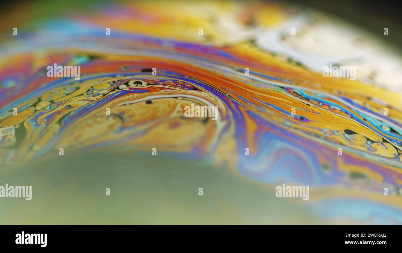 Paint mix holographic sphere rainbow oil stain Stock Photo - Alamy