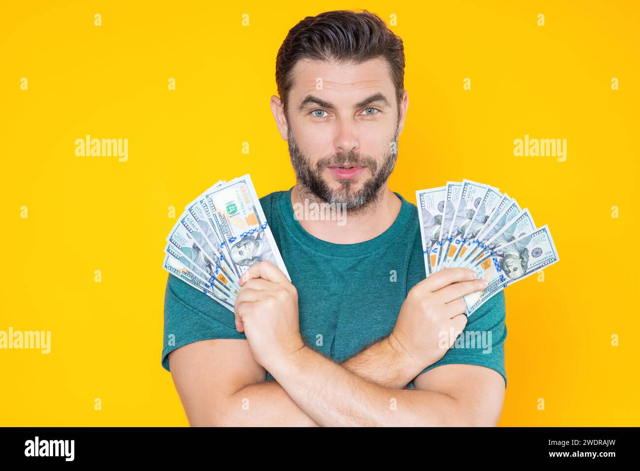 Money cash, dollar banknotes concept. Portrait of man holding bunch of ...