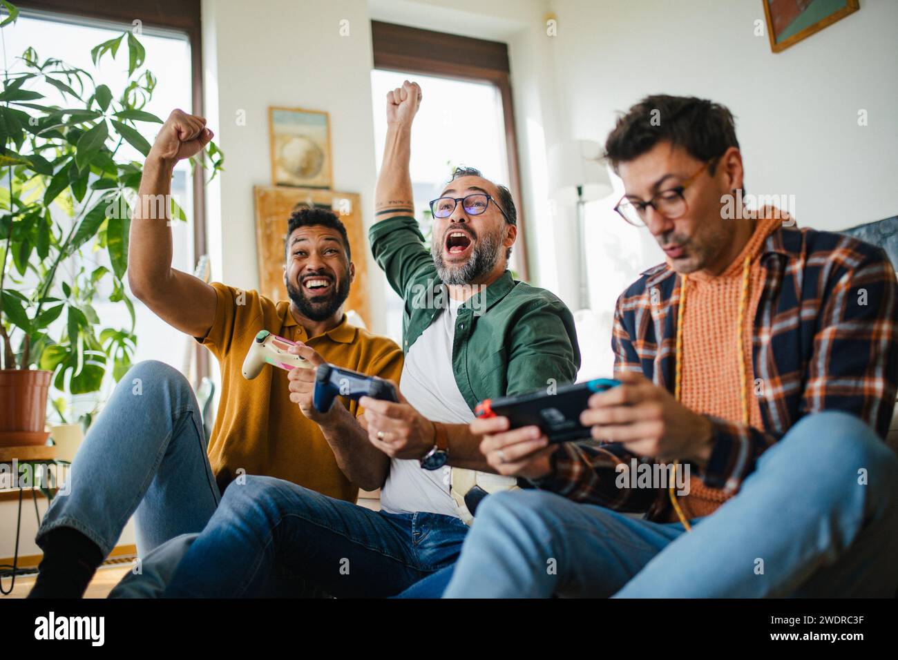 Best friends playing together on a gaming console, competing. Concept ...