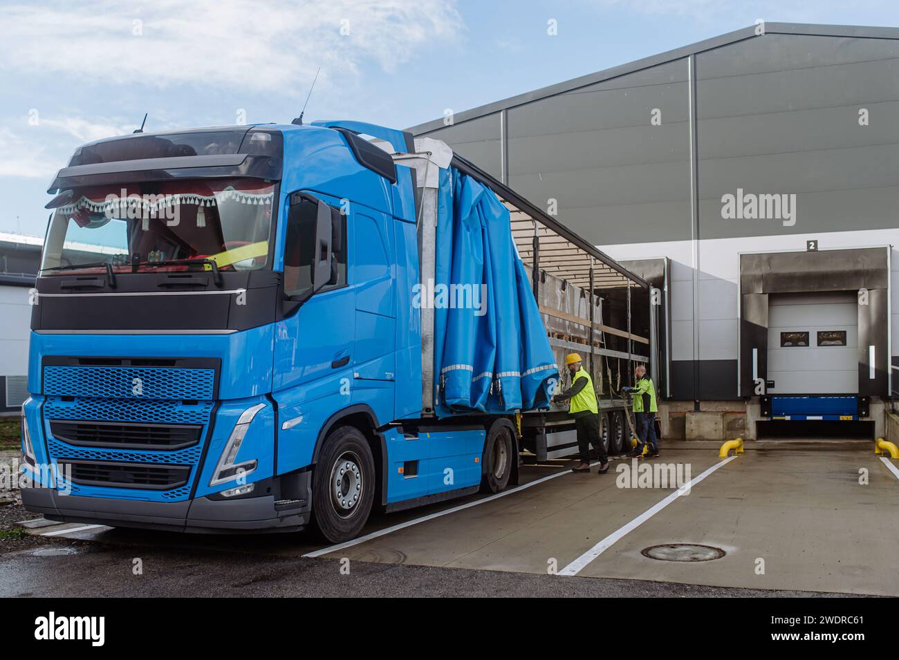 Warehouse receivers unloading of the truck in front of warehouse ...