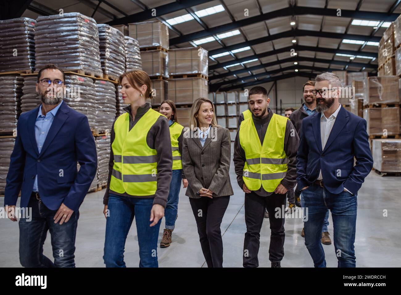 Full team of warehouse employees standing in warehouse. Team of workers ...