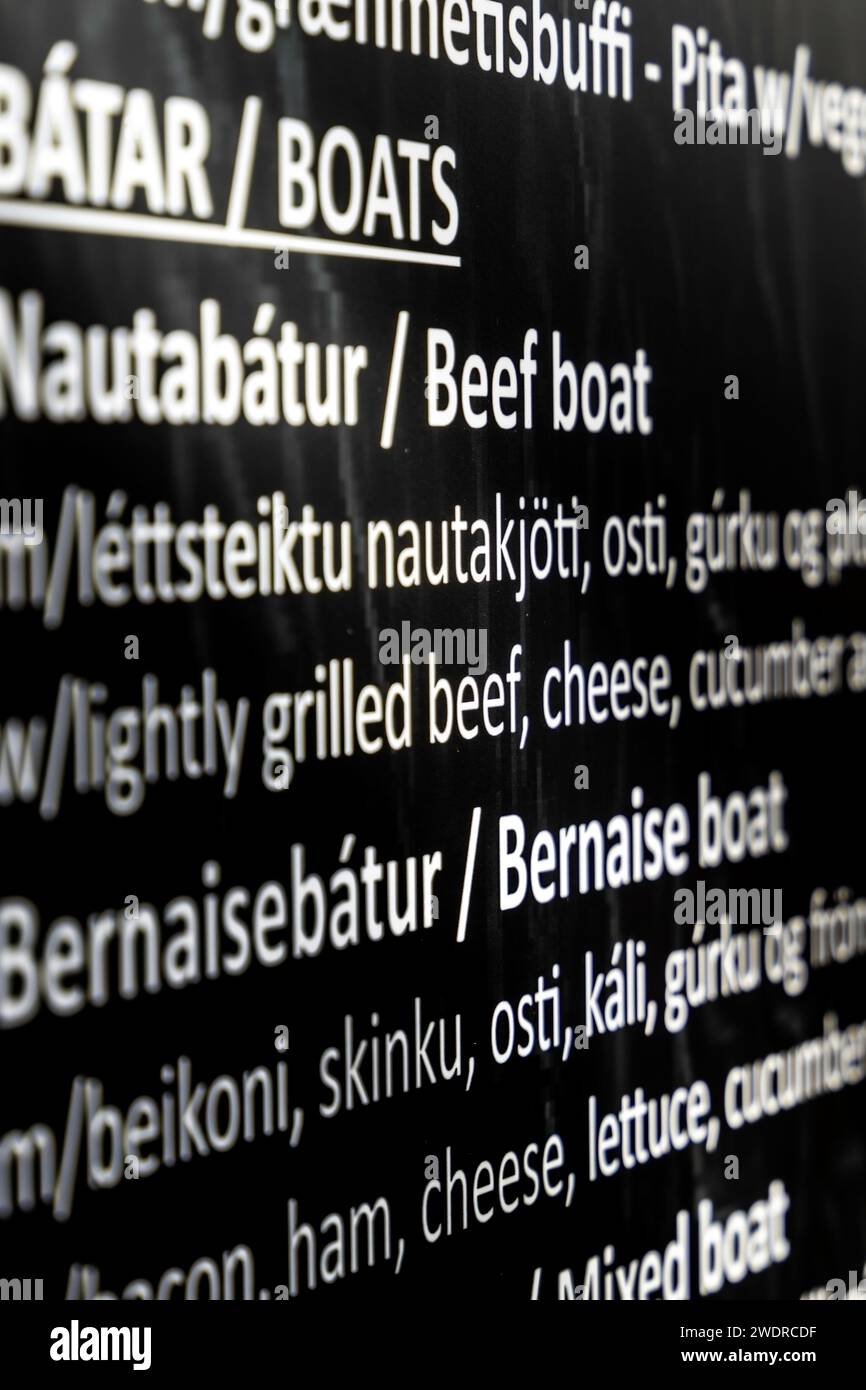 Black signboard with list of beef vegetables and food items on display ...