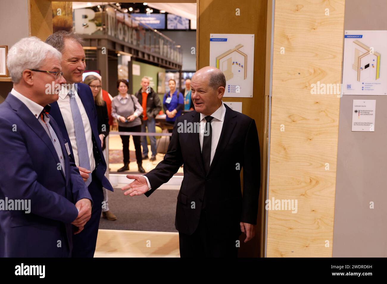 German Chancellor Olaf Scholz, right, speaks to Torsten Gabriel from ...