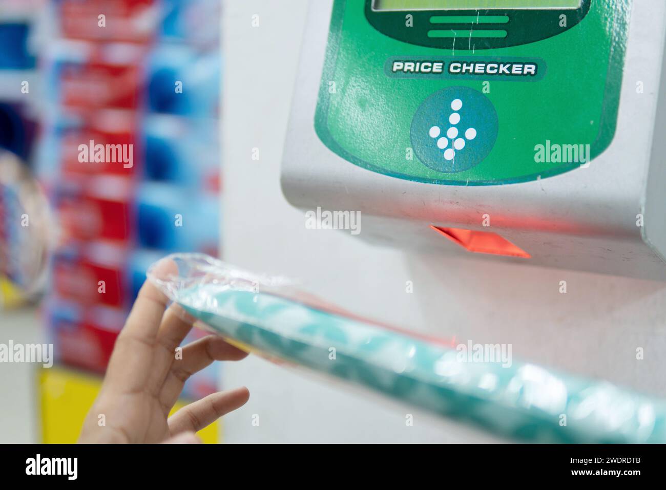 Closeup image of customer using price checker at supermarket Stock ...
