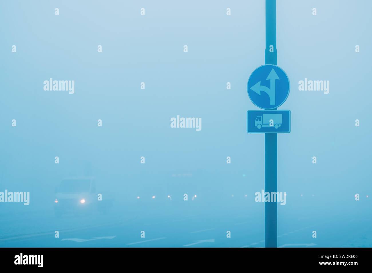 Directional traffic sign for trucks in fog, selective focus Stock Photo ...