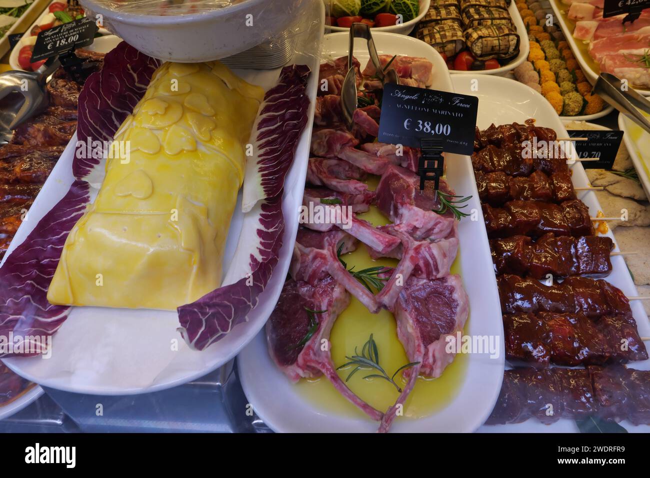 HANDMADE MEAT DISHES ON DISPLAY INSIDE THE FEROCI MEAT SHOP. FEROCI IS ...