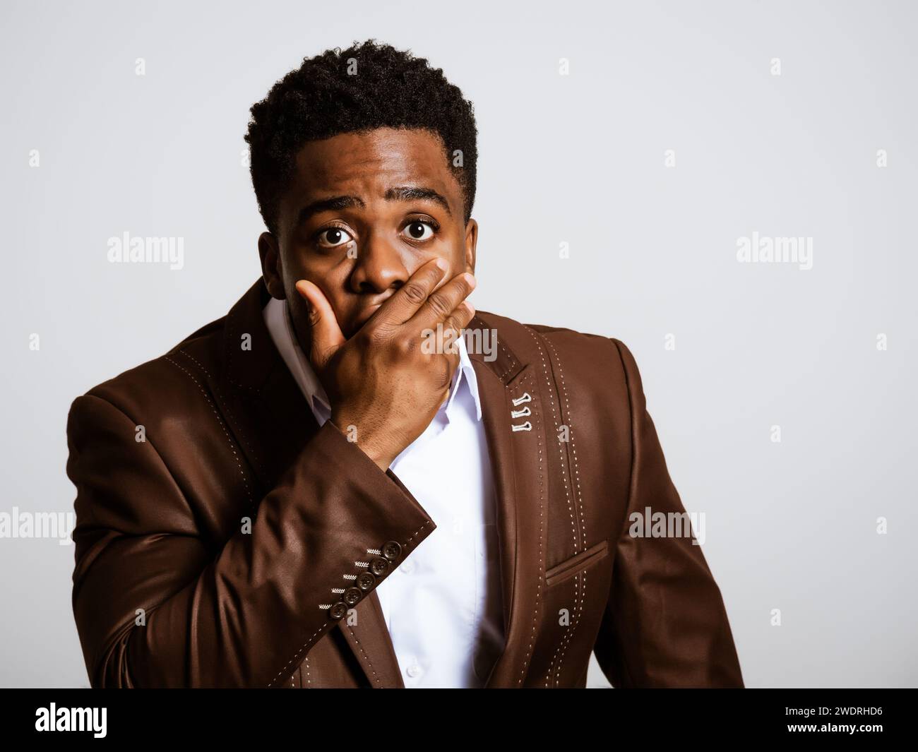 Portrait of young businessman who is shocked Stock Photo - Alamy