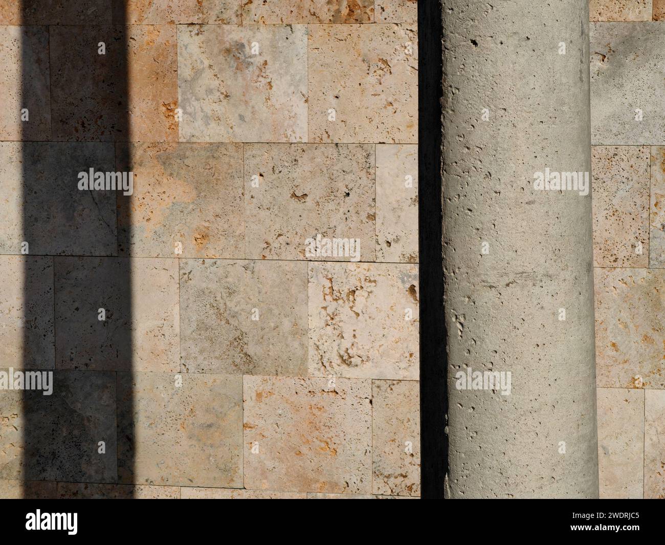 Stone wall background, pattern and texture.Light and shadow. Sunny day ...