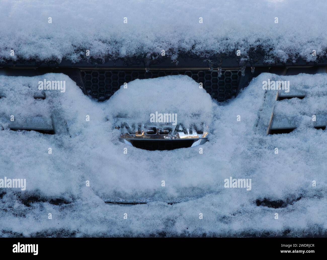 Nissan japanese car brand logo cover with snow.Front bumper Stock Photo ...