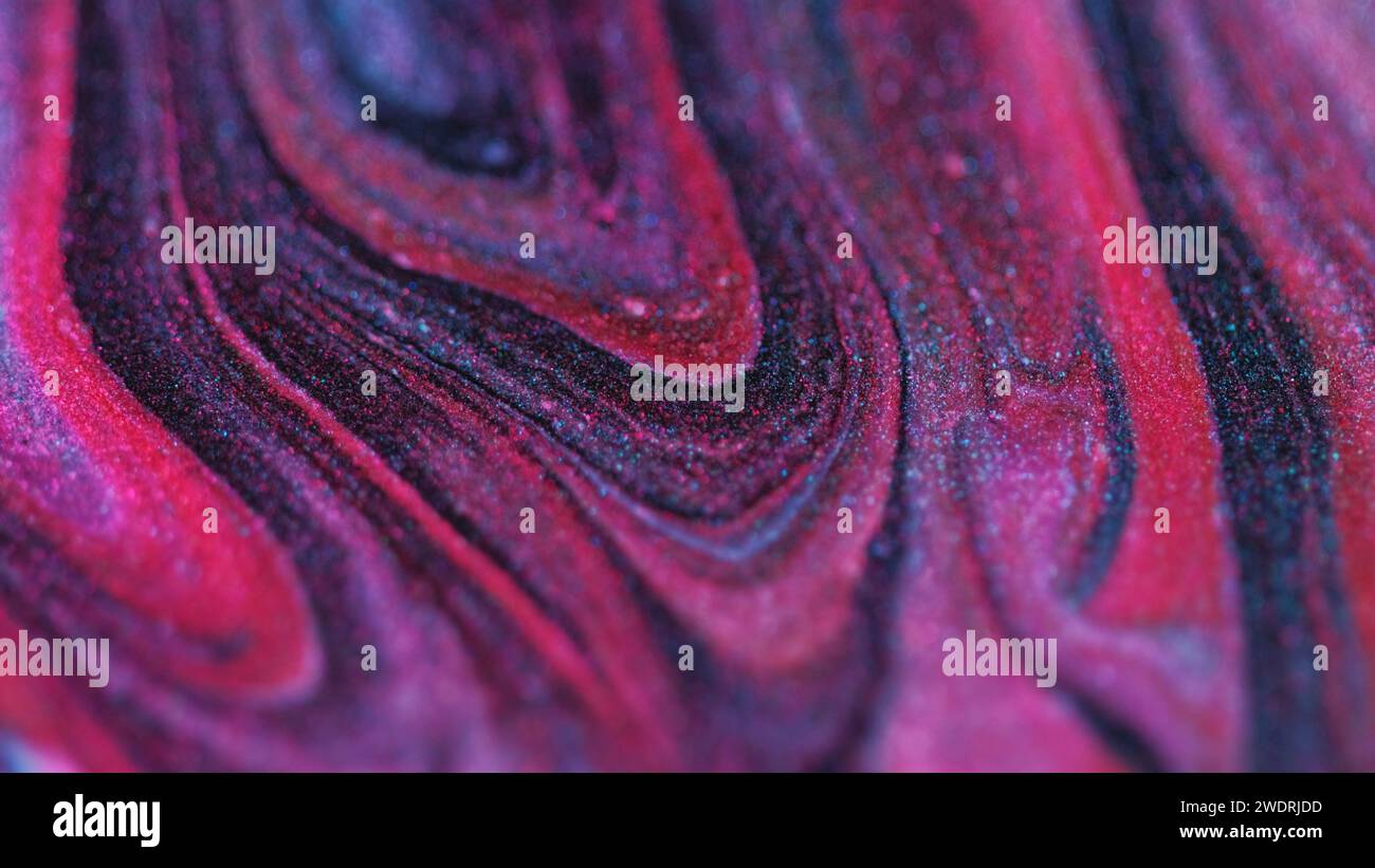 Glitter fluid spill paint blend pink blue emulsion Stock Photo - Alamy