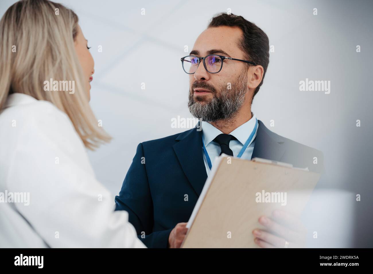 Female doctor multitasking hi-res stock photography and images - Alamy