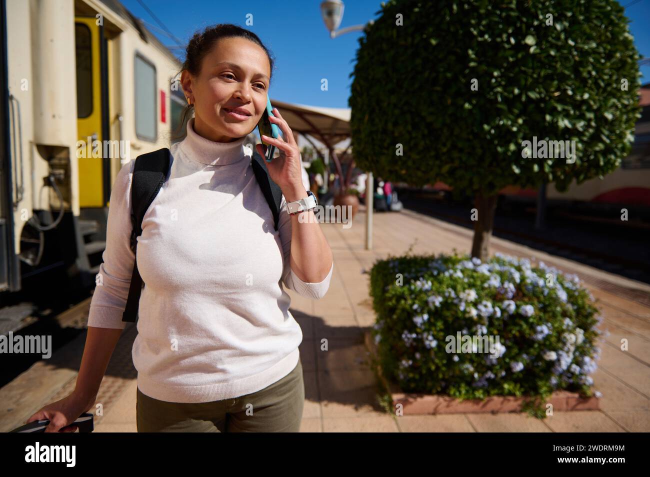 Happy confident young business lady, a backpacked woman carrying her ...