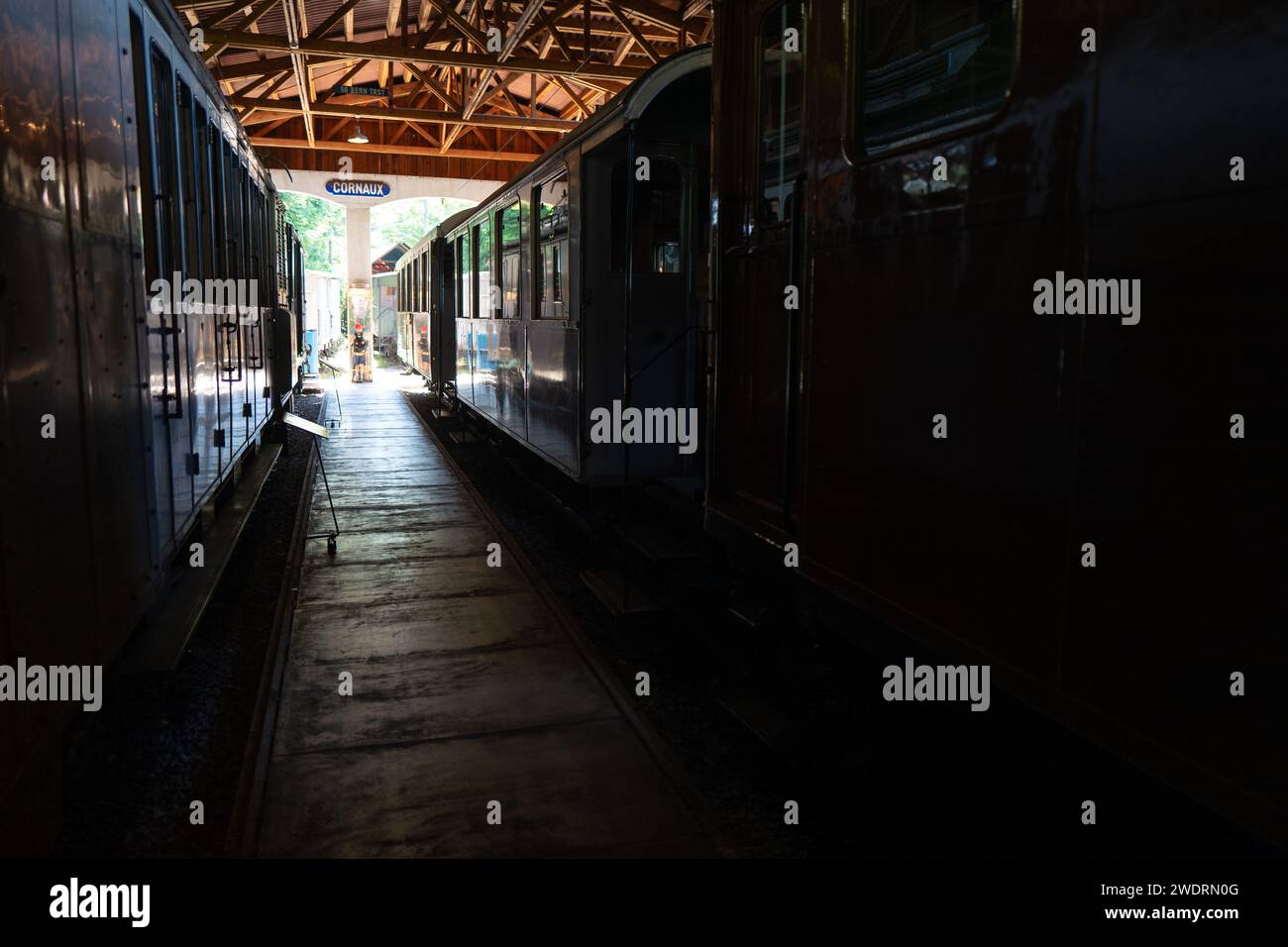 The two trains on tracks with a narrow path between them. Cornaux ...