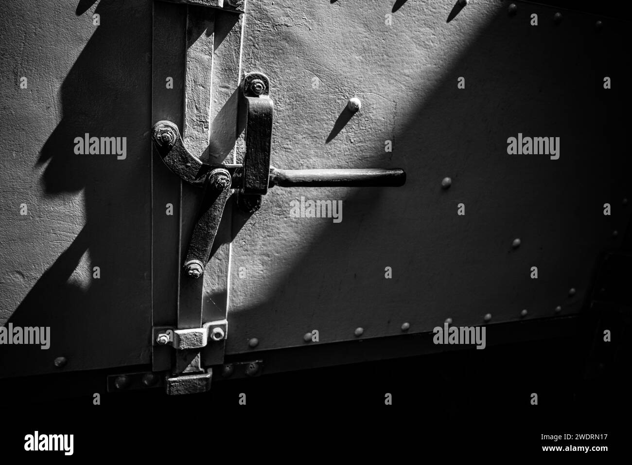 A close-up of a metal train door handle Stock Photo - Alamy