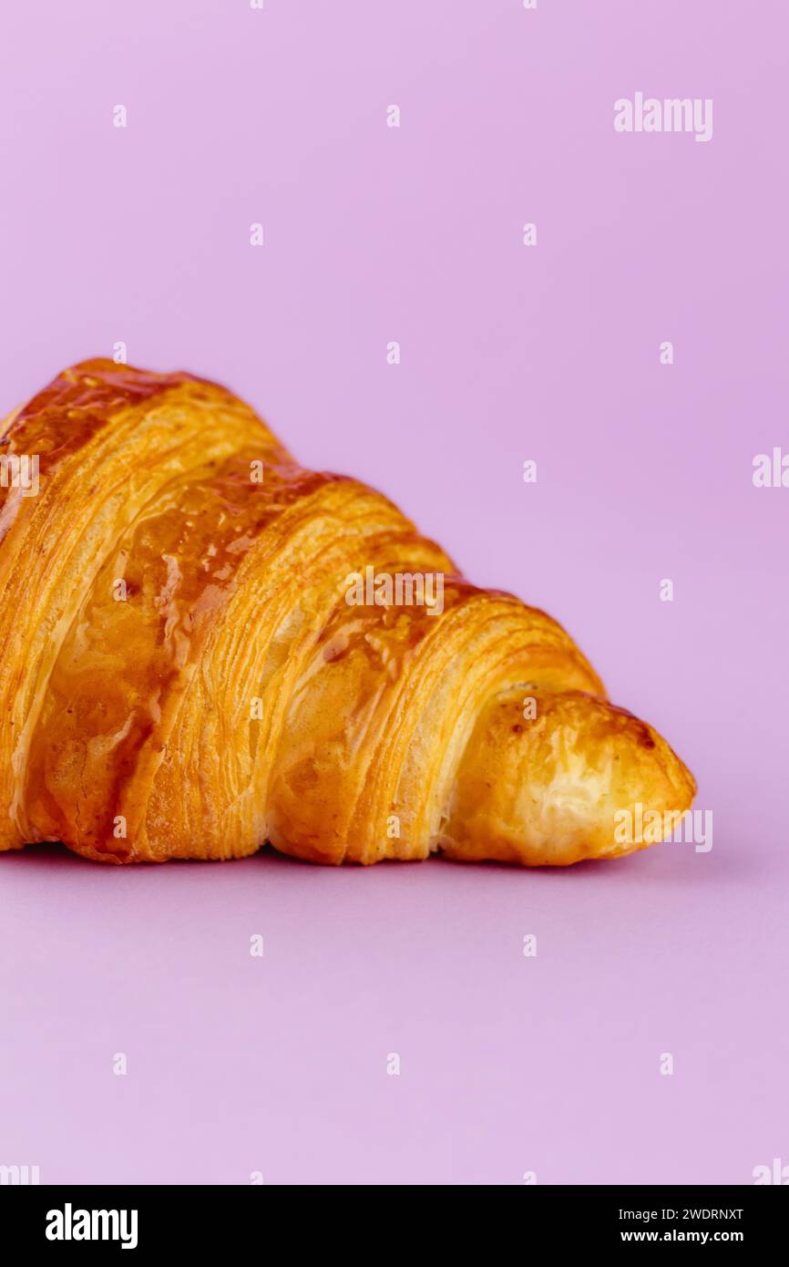 French croissant on a pink background Stock Photo - Alamy