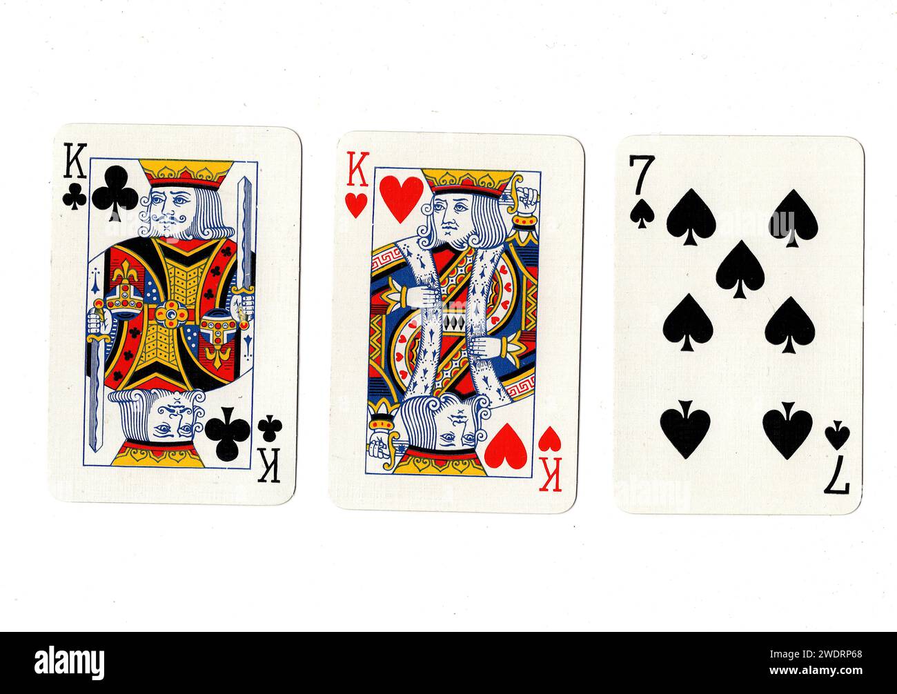 Vintage playing cards showing a pair of kings and a black seven ...