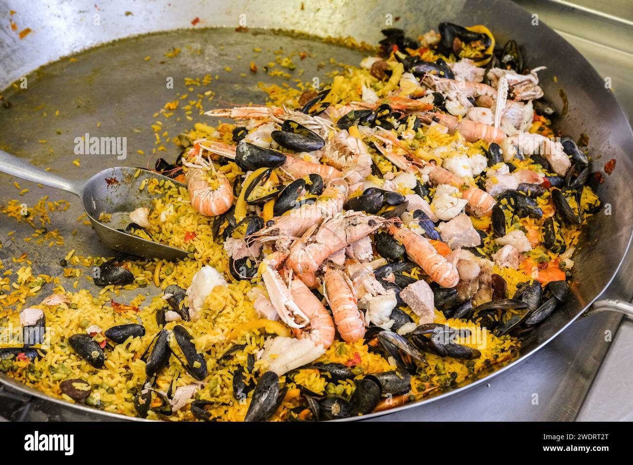 Seafood risotto with fresh shrimp and mussel at pan. Rustic rice with ...