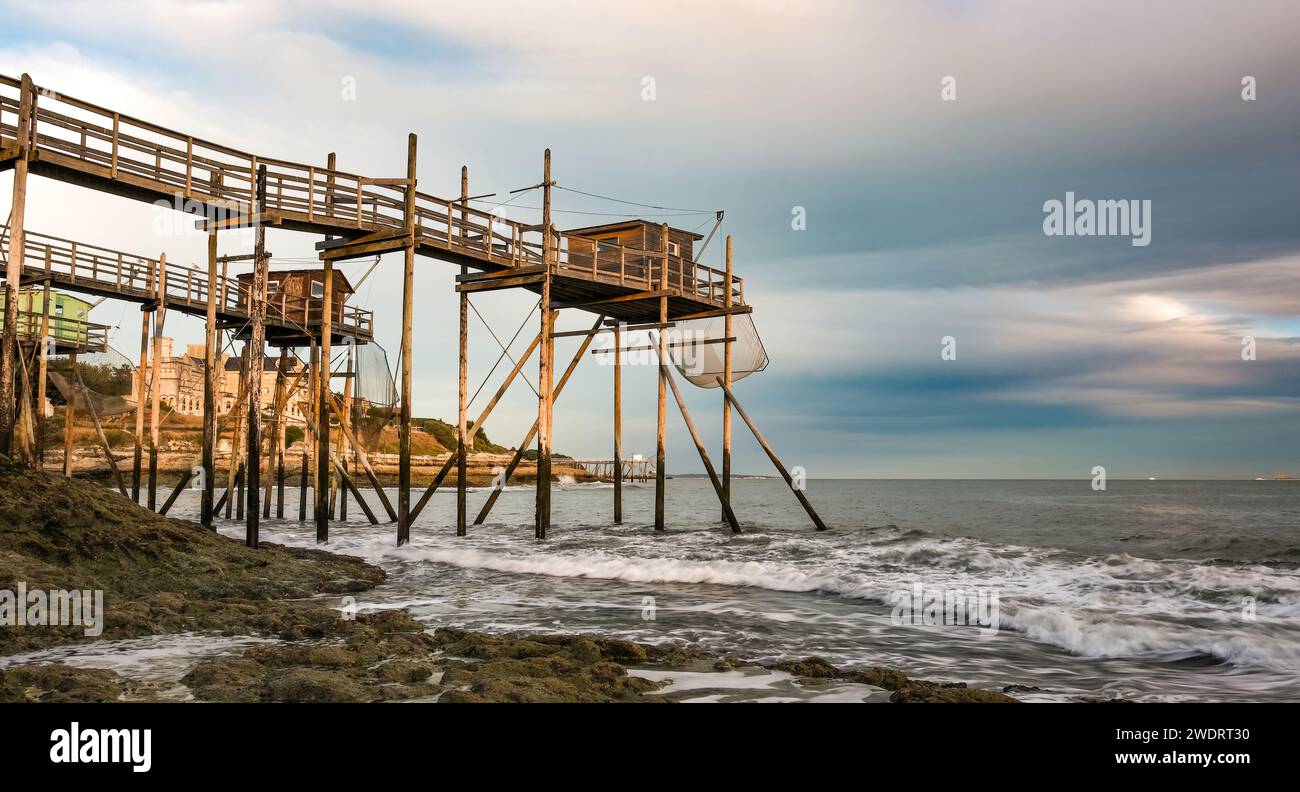 Traditional fisherman hut on stilts with carrelet fishing net. Typical ...