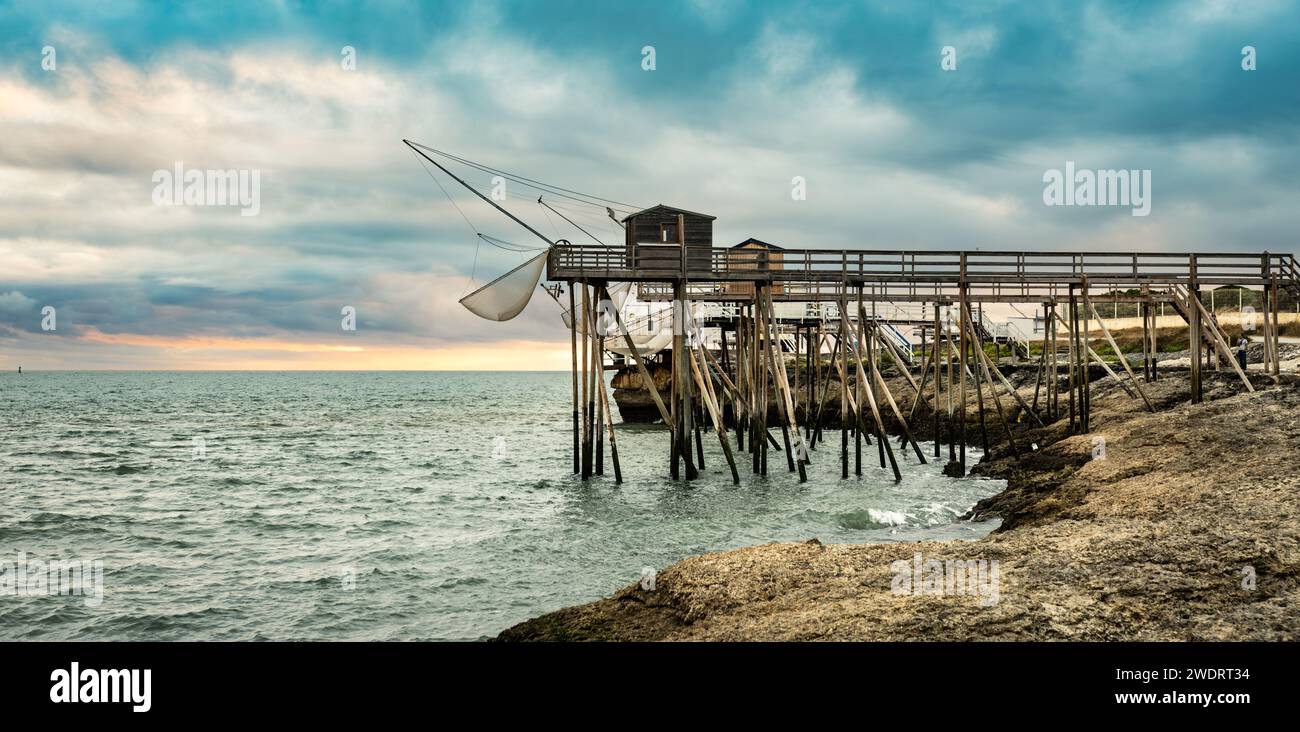 Traditional fisherman hut on stilts with carrelet fishing net. Typical ...