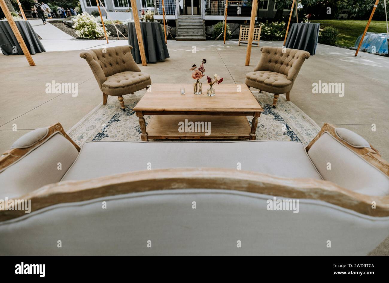 Chairs in seating area with flowers at a wedding reception Stock Photo ...