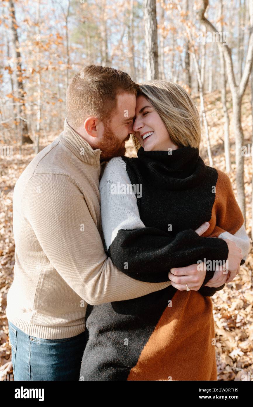 happy couple smiling nuzzling each other after engagement Stock Photo ...