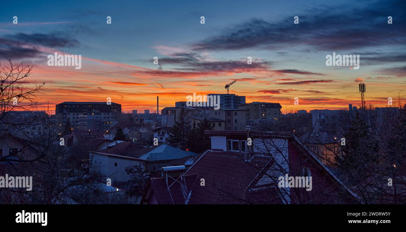 Colorful urban sunset of an industrial zone with real estate ...