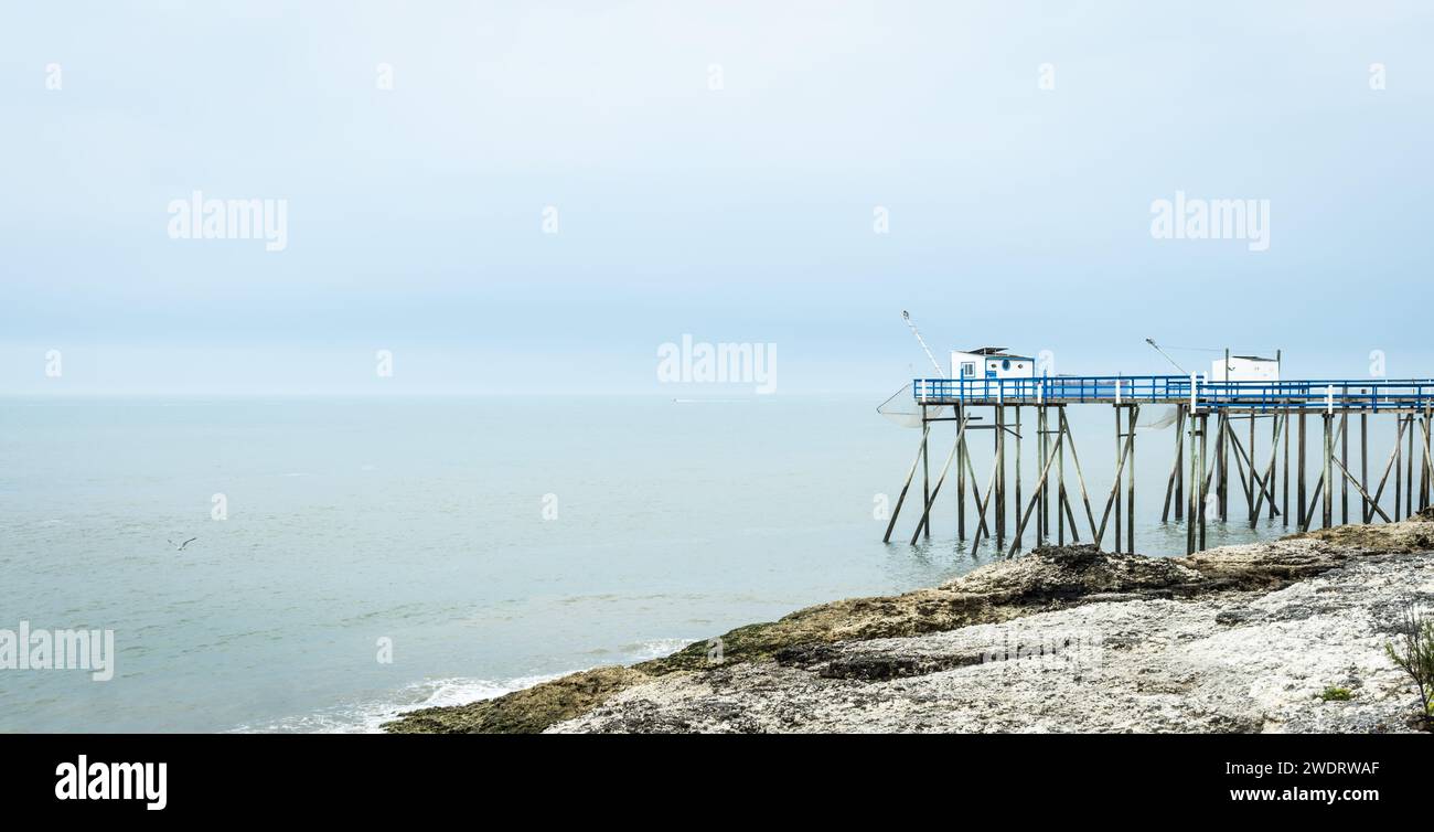 Traditional fisherman hut on stilts with carrelet fishing net at Saint ...