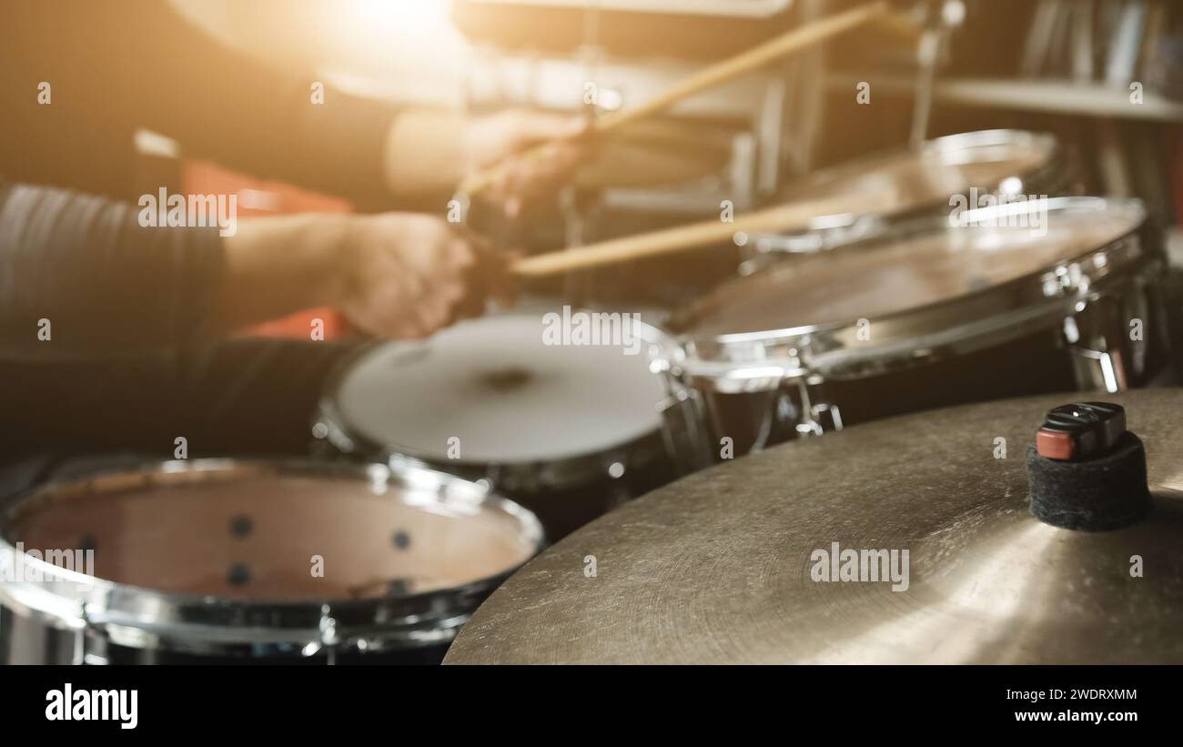 playing drums with drumsticks with rock beat, hihat rythm. Musician ...